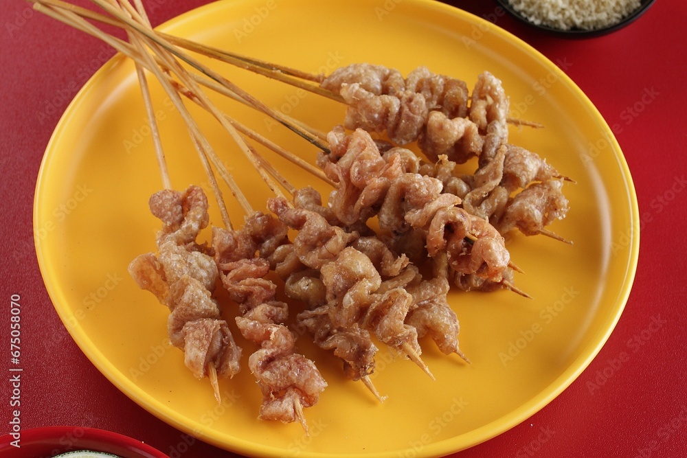 Sate taichan is a variation of chicken satay grilled and served without ...