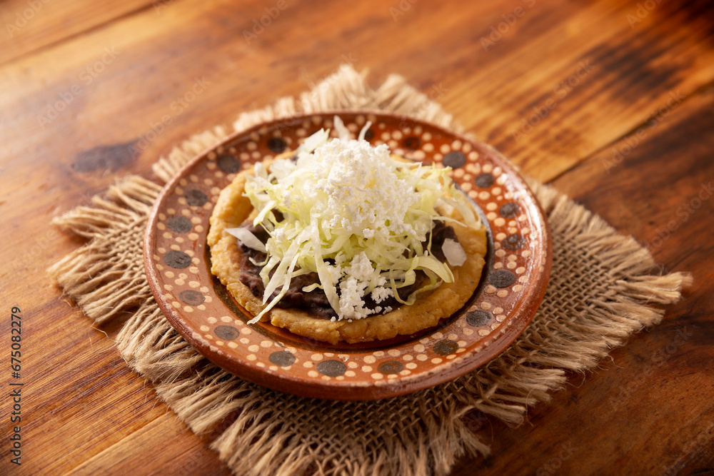 Sope. Mexican typical food prepared with flattened fried corn dough ...