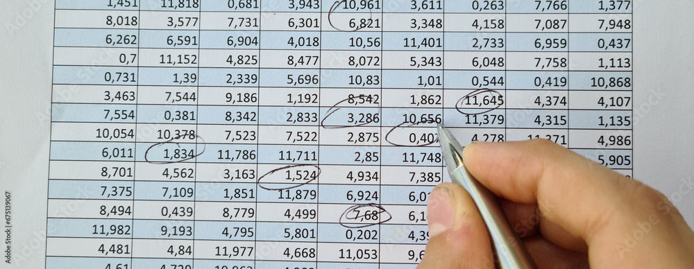 Hand with pen analyzing numbers in report spreadsheets Stock Photo ... Hand with pen analyzing numbers in report spreadsheets Stock Photo ...