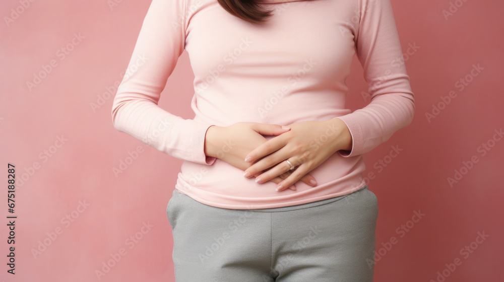 sad young woman holding her stomach, illness, cramps, health, color ...