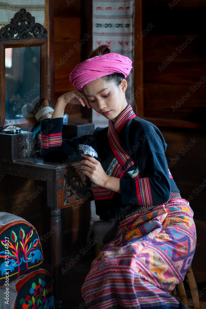 Pretty Asian Tai Lue women in beautiful traditional costumes doing ...