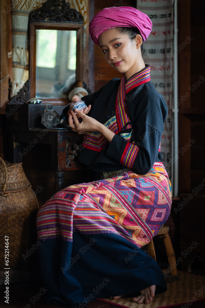 Pretty Asian Tai Lue women in beautiful traditional costumes doing ...