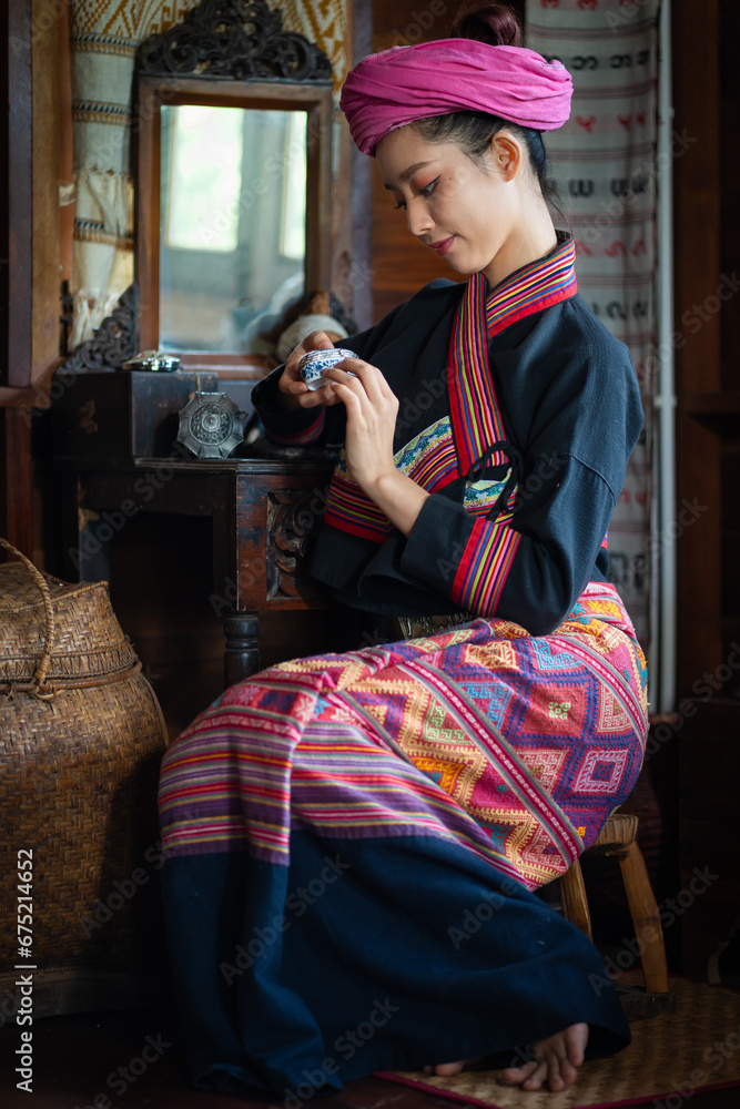 Pretty Asian Tai Lue women in beautiful traditional costumes doing ...