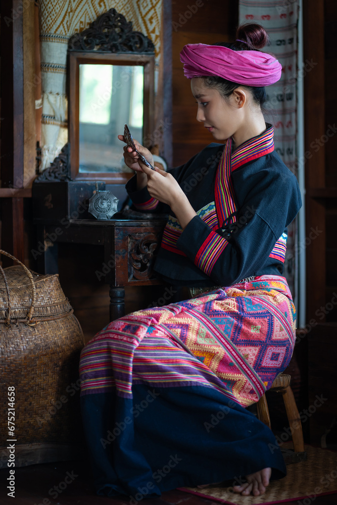 Pretty Asian Tai Lue women in beautiful traditional costumes doing ...