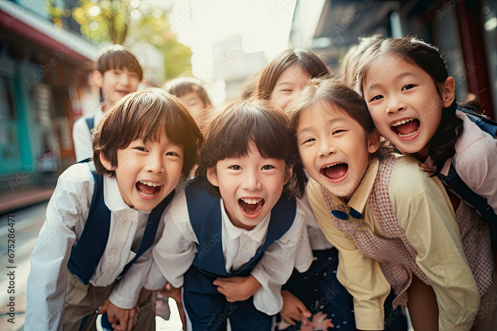 A photograph featuring a cheerful group of Asian primary school students diligently studying ...