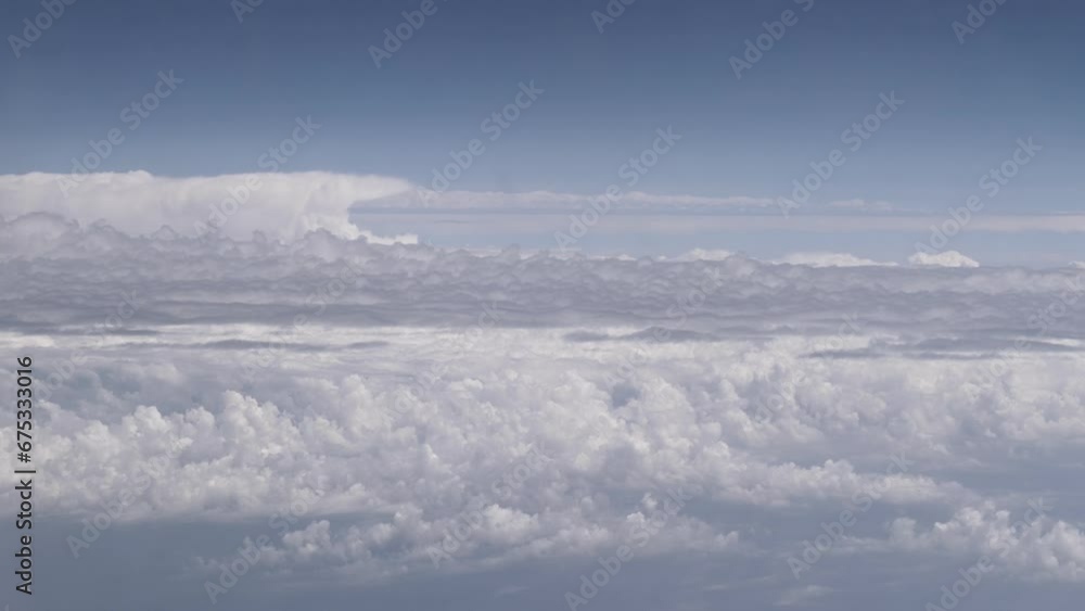 Side view from an airplane window to the horizon line between layers of ...
