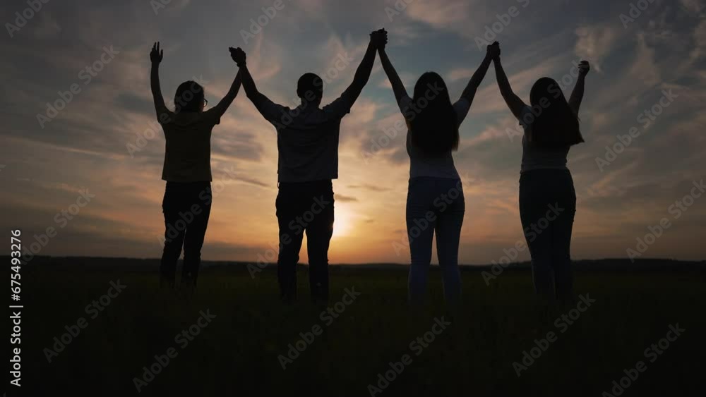 Silhouette of group of people. People holding hand together symbol of ...
