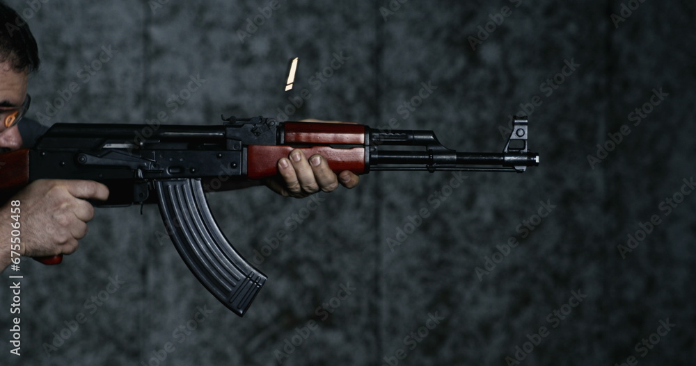 Side view of person shooting an AK-47 Rifle in high-speed 800 fps. Slow ...