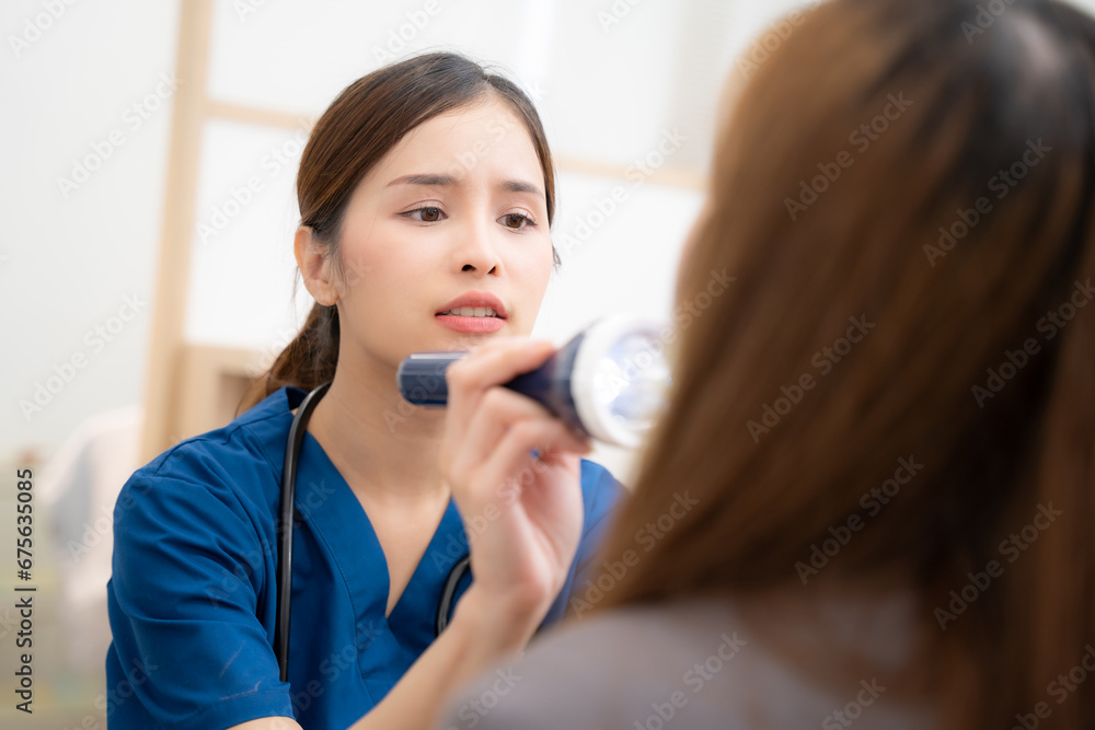 Beautiful nurse checking mouth patient at hospital room. She holding ...