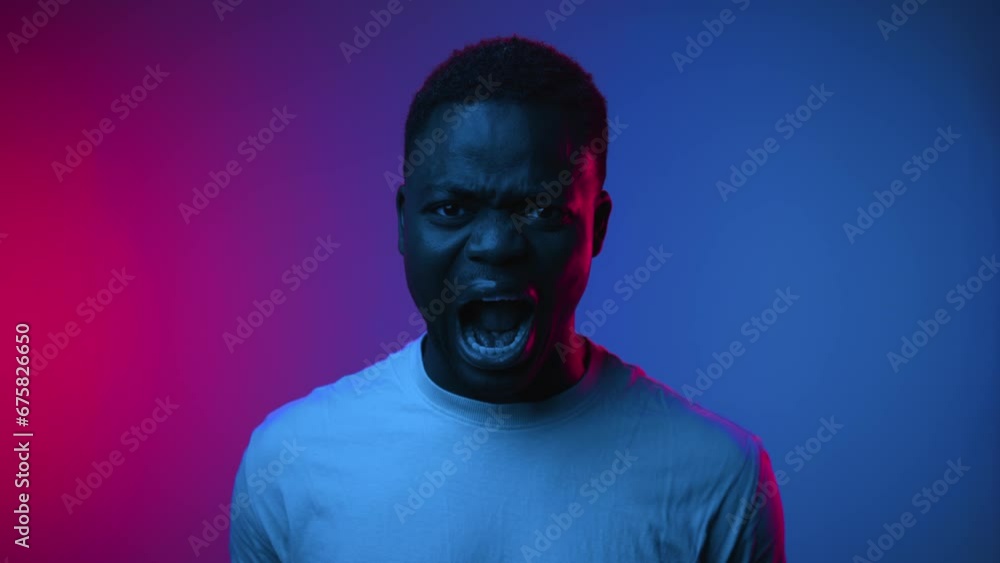 Portrait of Black Man Looking at Camera and Screaming in Neon Color ...