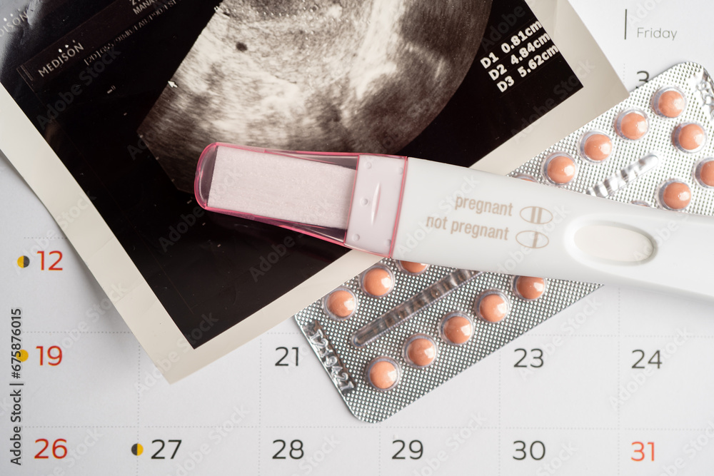 Pregnancy test and birth control pills with ultrasound scan of baby ...
