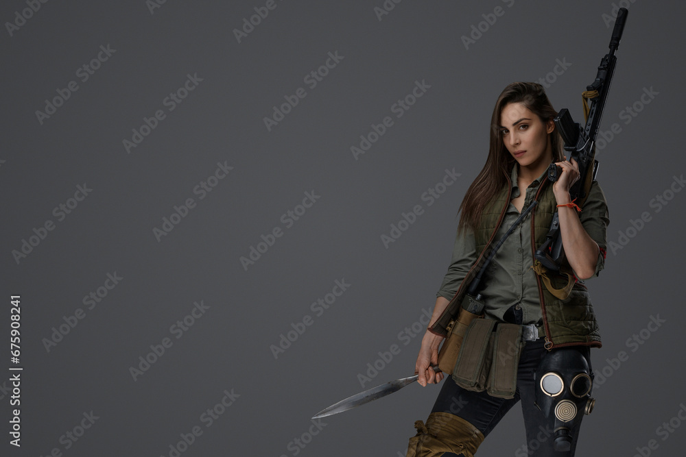 Middle Eastern woman, dressed in post-apocalyptic survivalist gear ...