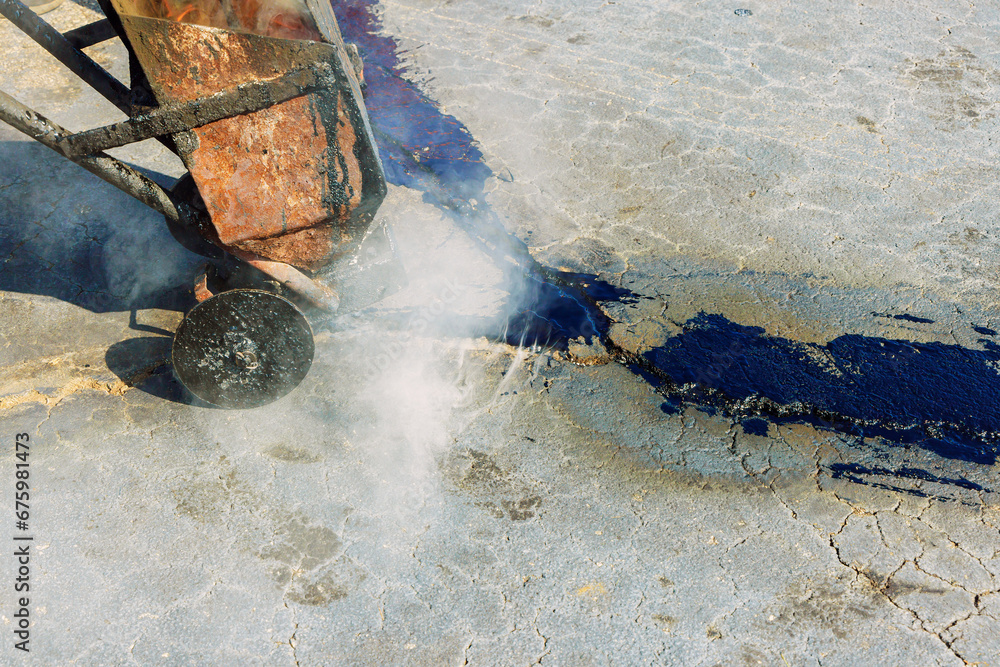 Joint seal filler liquid to repair cracks in asphalt with bitumen ...