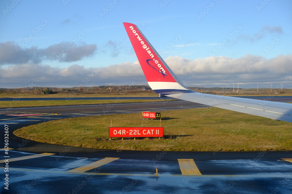 Norwegian Air Shuttle Boeing 737 800 wing, logo and runway signs at ...