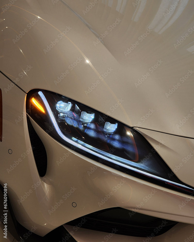 White Toyota Supra MK5 headlight focused shot, top down view, cropped ...