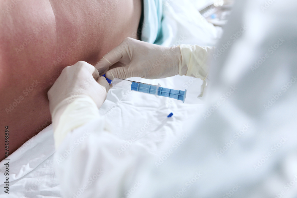 Epidural anesthesia. Injection for spinal anesthesia. Nerve blockage.An ...