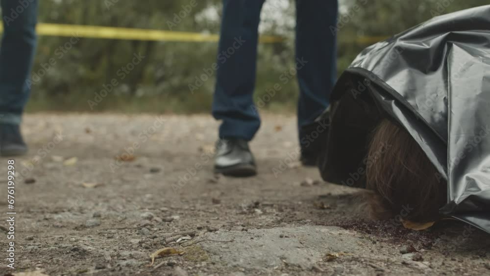 Low section of unrecognizable detective man joining his colleague at ...