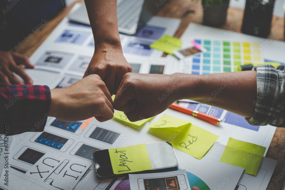 Design team, ux ui developers join hands to brainstorm on the design of ...