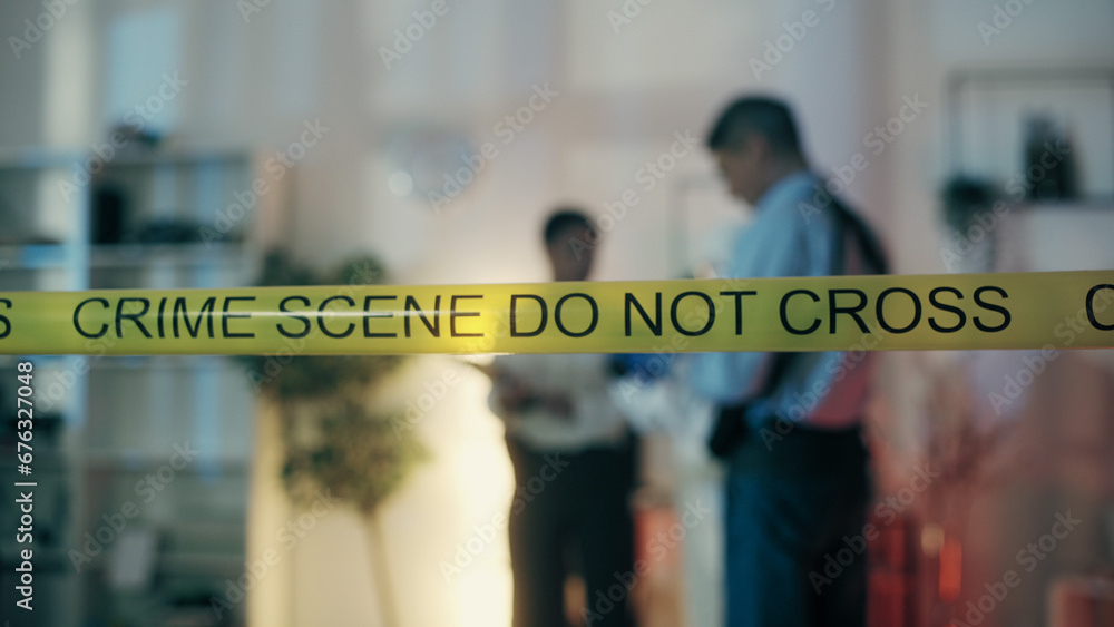 Yellow tape is securing the crime scene, with the police department ...