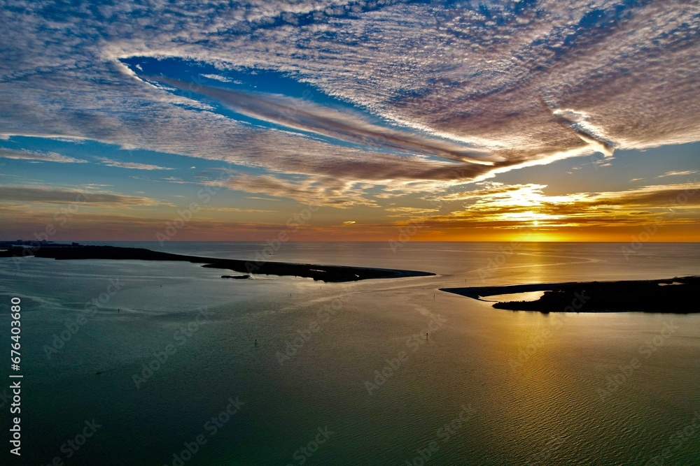 The drone photos of a beautiful sunset at Dunedin Causeway Beach, Tampa ...