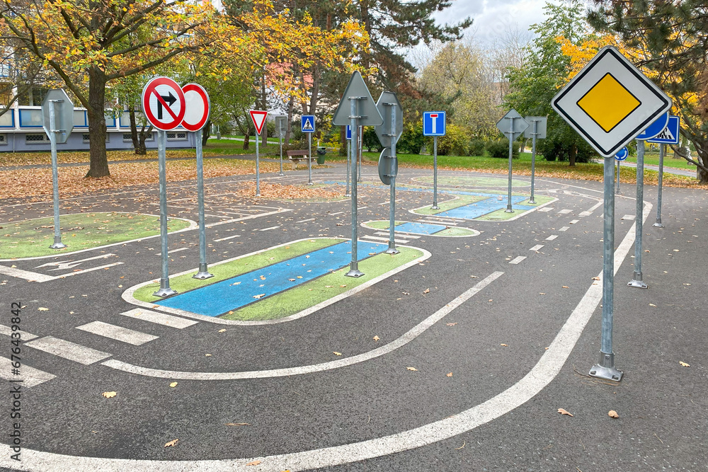 A children's playground designed as a mini road with road signs ...