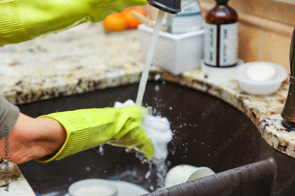 hand-washing dishes, symbolizing equality and shared responsibilities ...