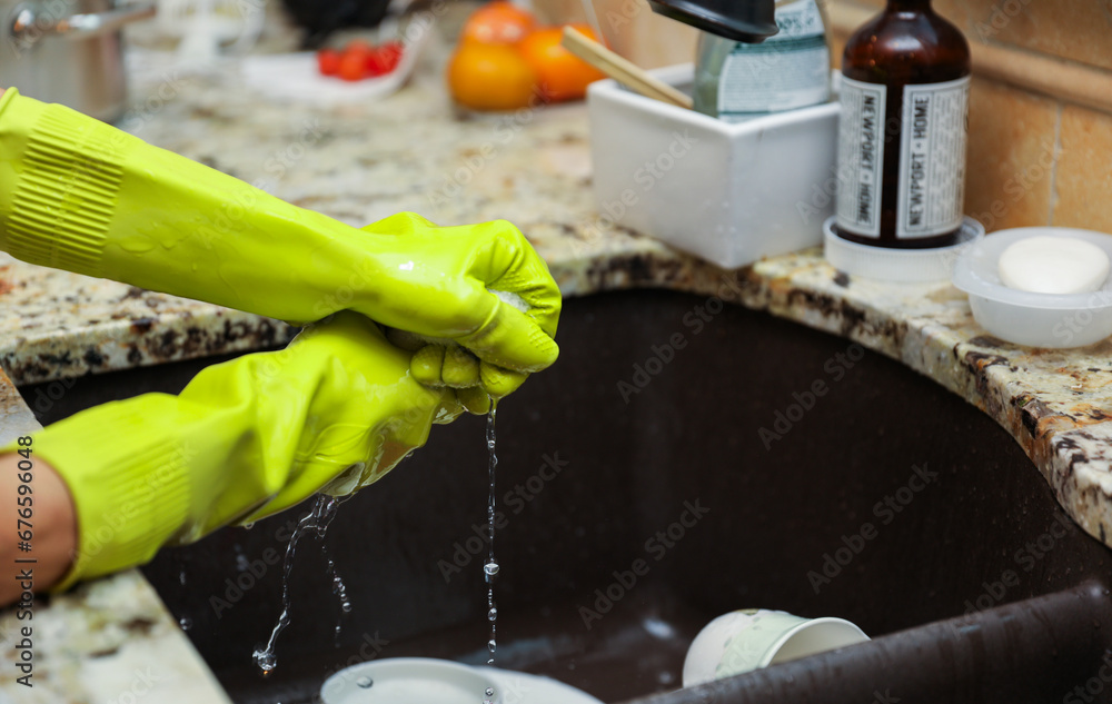 hand-washing dishes, symbolizing equality and shared responsibilities ...