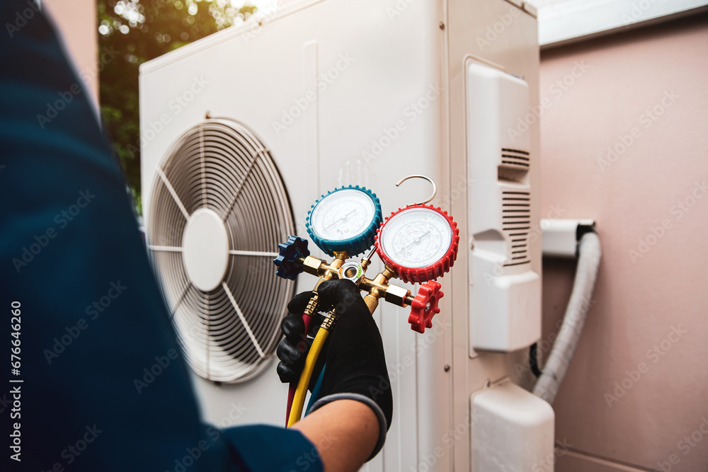 Heat and Air Conditioning, HVAC system service technician using ...