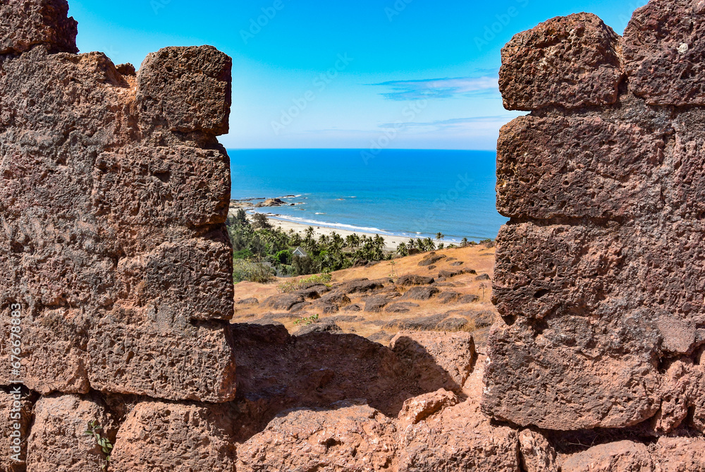 Fortress tower in Fort Chapora. In the background is a view of the ...
