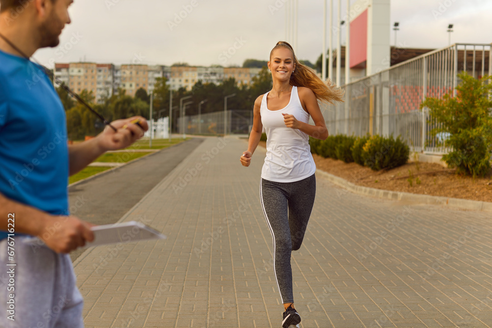 Slim attractive woman athlete sportswoman in sportswear prepares for ...