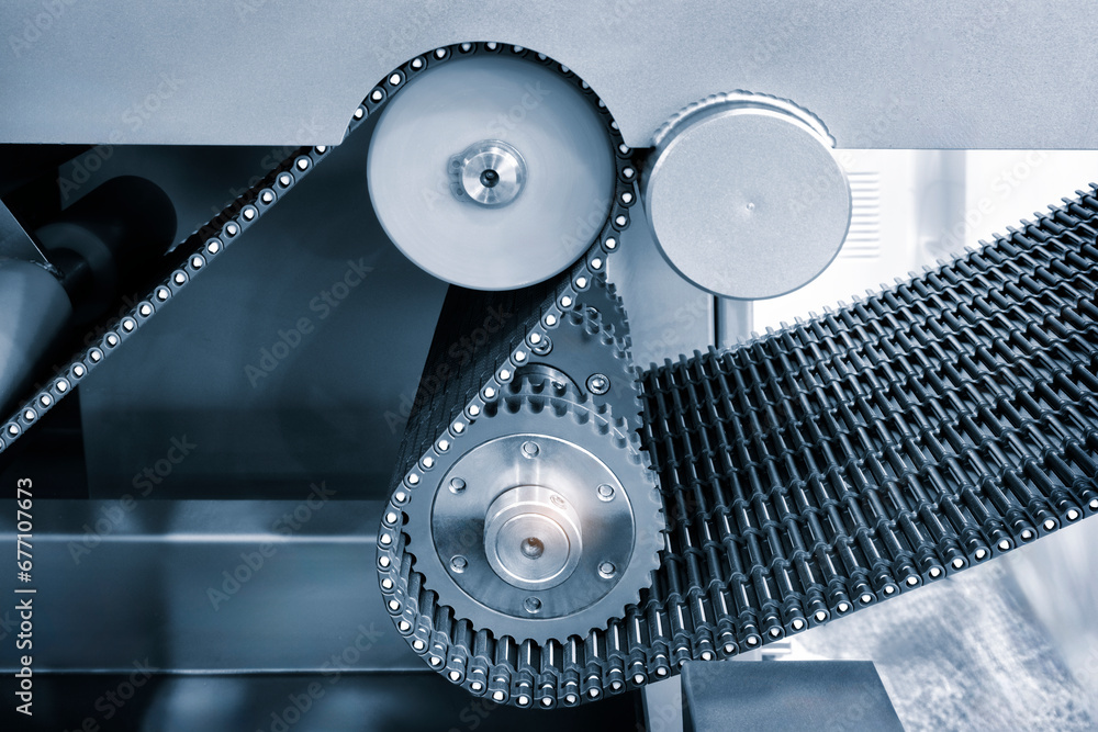 Gear chain drive shaft in conveyor belt is on production line. Timing ...