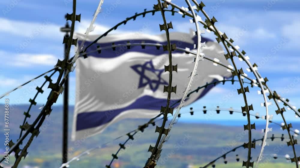 Barbed wire, flag of Israel on flagpole in defocus, sky background with ...