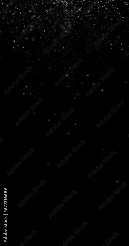 Falling down flickering dots on clean black vertical background ...