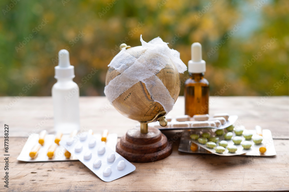 bandaged globe, planet sick concept, medicines and pills, planet sick ...