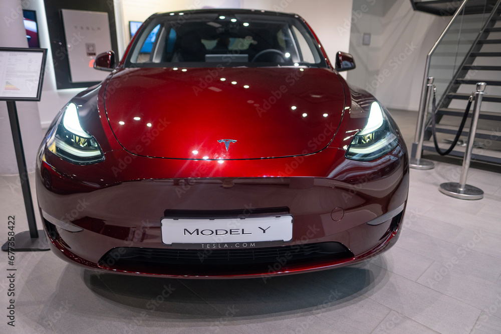 new red model Y Tesla electric car in showroom, trends in use EV in ...