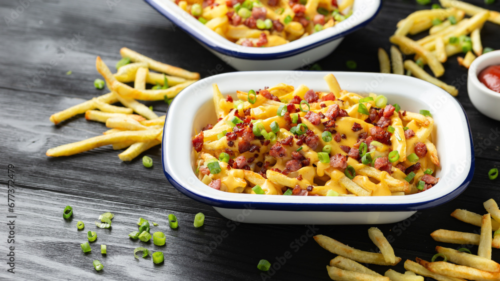 Crispy French fries loaded with bacon, cheese sauce and spring onion ...