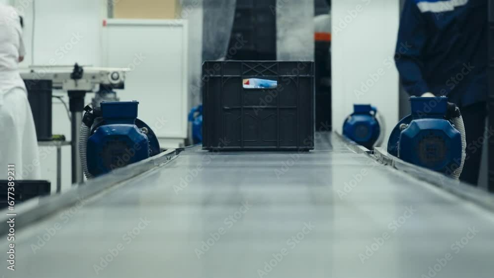 Plastic Container Transported By An Automated Industrial Conveyor Line ...