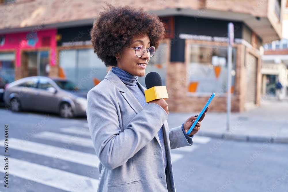 African american woman reporter working using microphone and touchpad ...