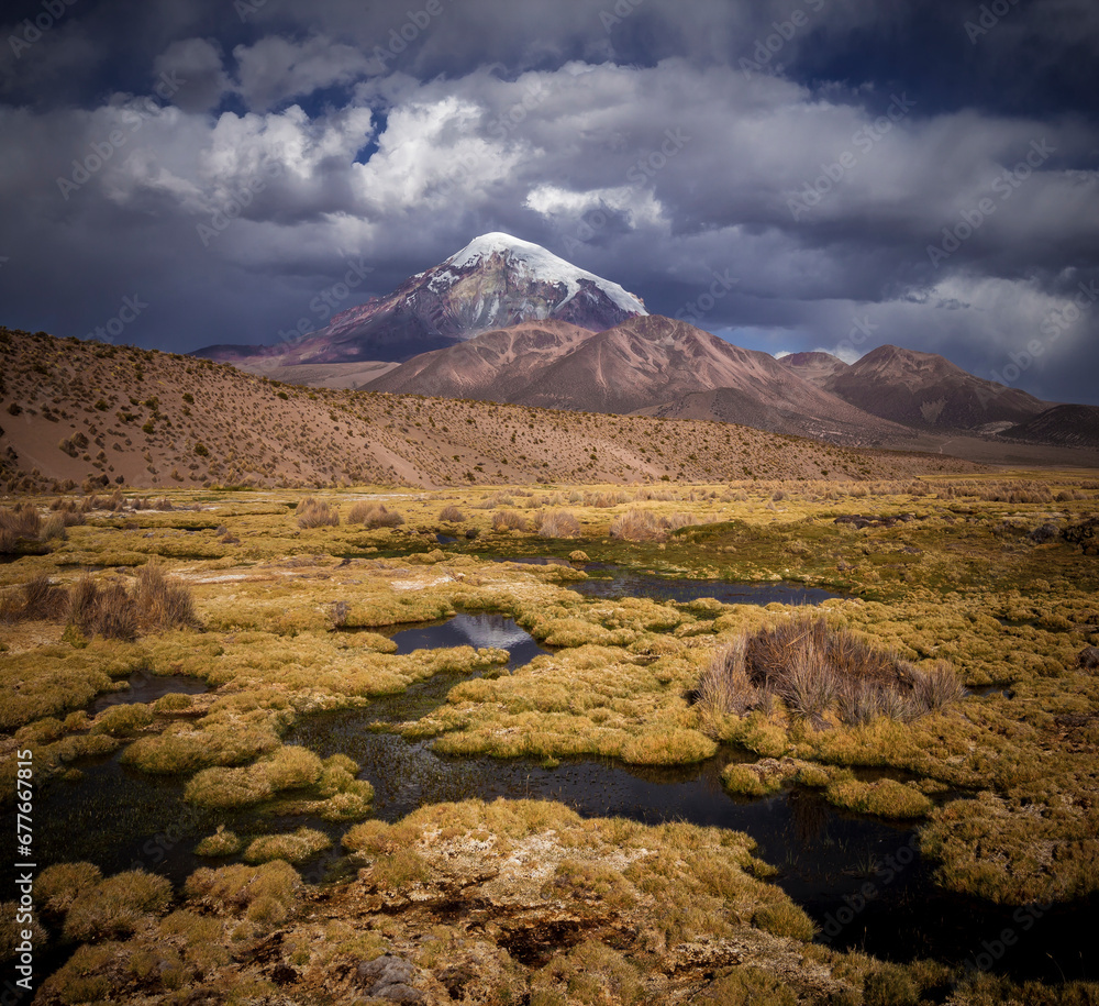 View of Nevado Sajama, an extinct stratovolcano with snow on top ...