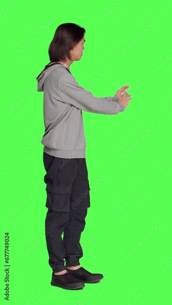 Side view of person pretending to push thing aside, expressing ...