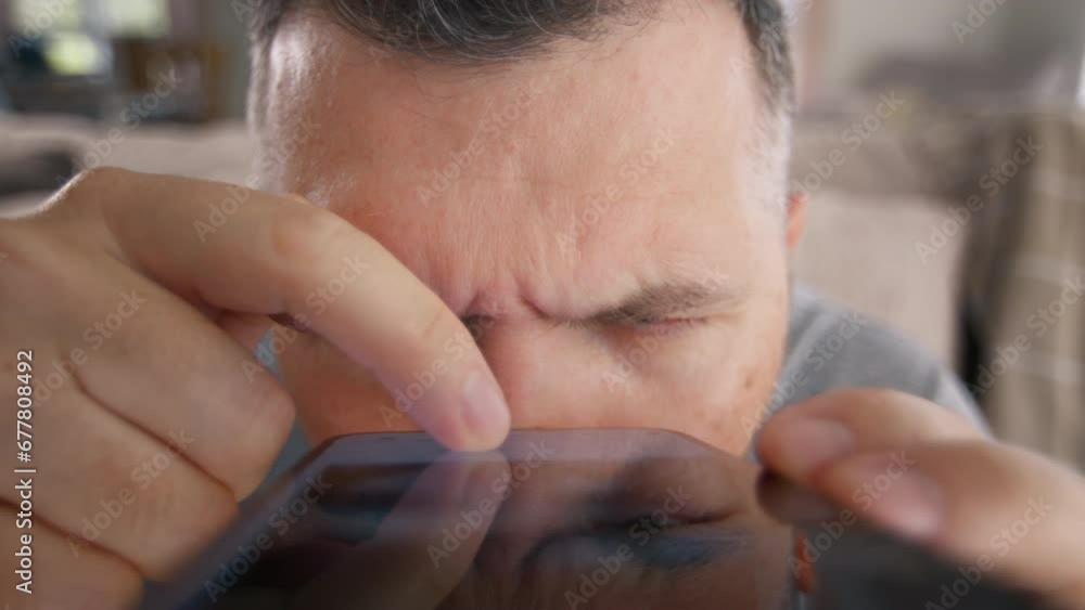 Curious nerd search. Close up funny male scrolling slow with one finger ...