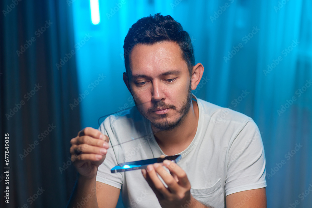 glass tempered protection film replace change mobile service. man hand ...