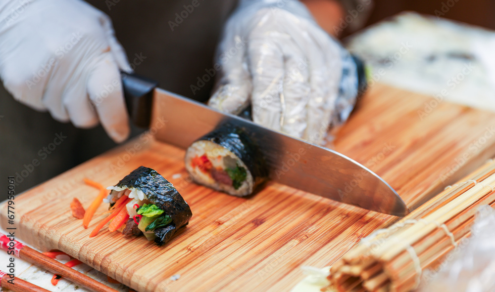 kimbap making, a cherished Korean culinary tradition. Skilled hands ...
