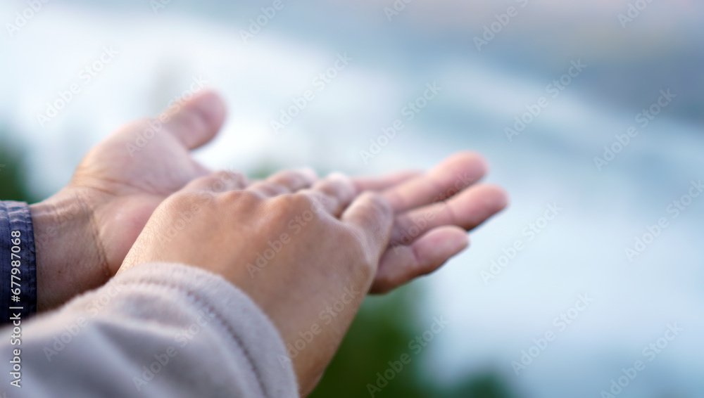 Blurry background helping hand of adult people. Man and woman holding ...