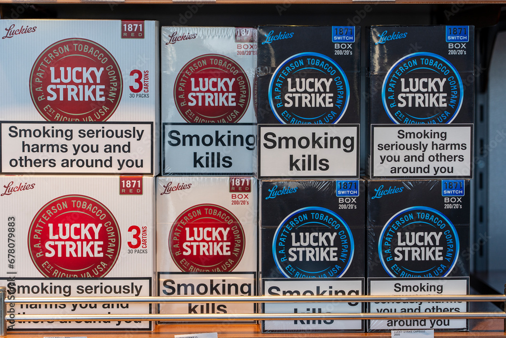 Lucky Strike cigarette boxes on the shelf in the duty-free shop inside ...