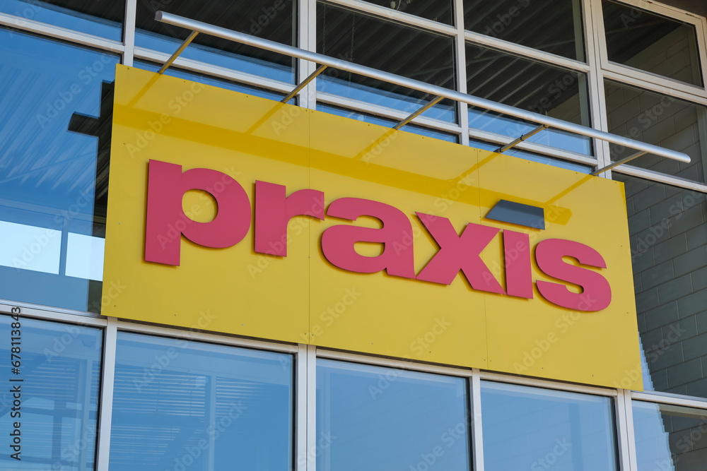 Praxis logo on a store. Praxis is one of the largest DIY chains in the ...