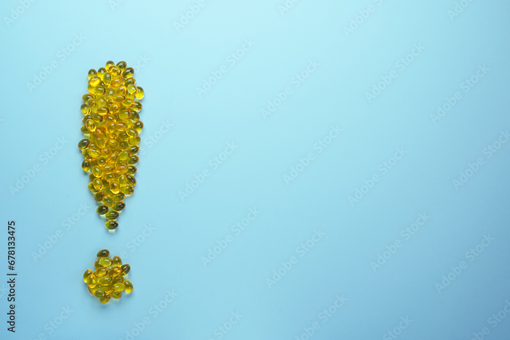 Exclamation mark made of oil filled capsules suitable for: fish oil ...