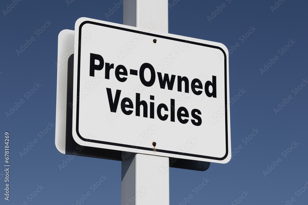 Pre-Owned Vehicle car sign at a dealership. With supply issues, used ...