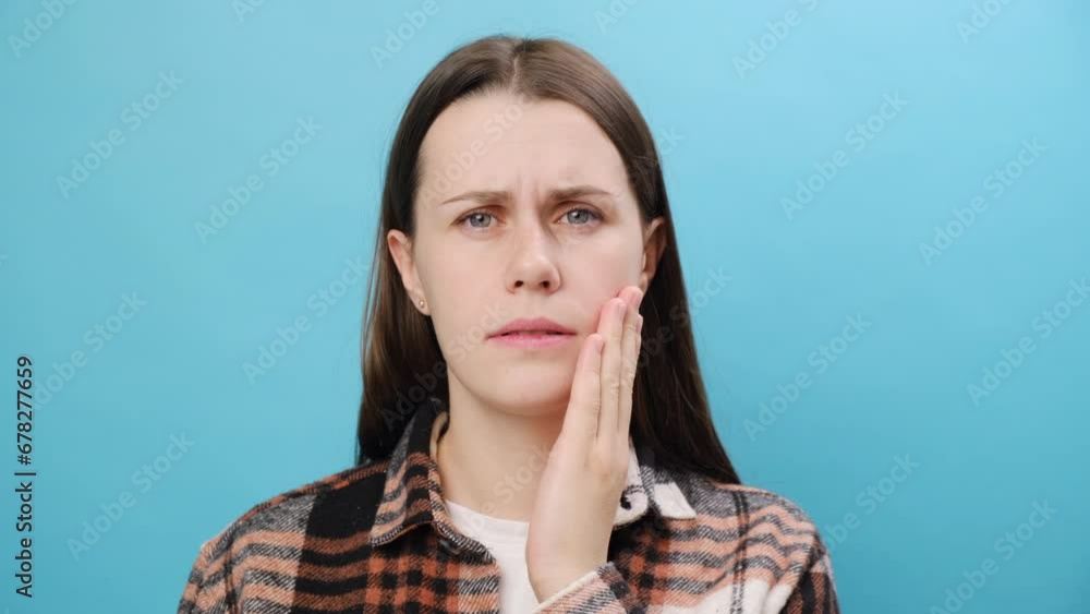 Close up of unhappy young woman suffering from toothache, isolated over ...