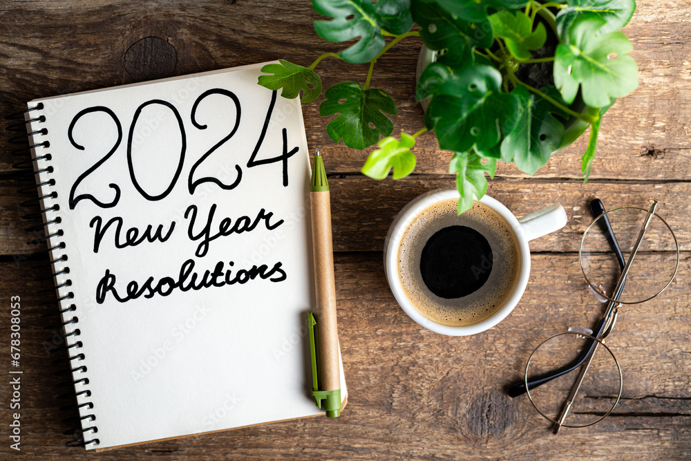 2024 New year resolutions on desk. 2024 goals list with notebook ...
